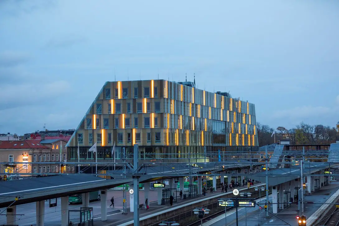 The new wooden building houses the town hall and railway station ...
